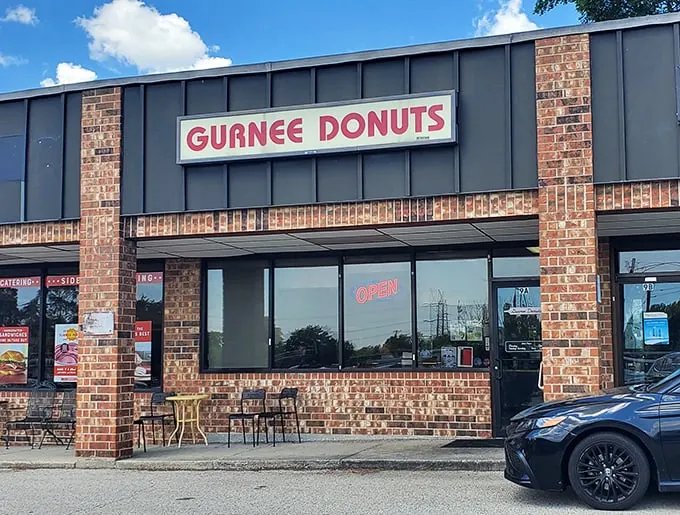 Classic brick and bold signage announce Gurnee Donuts' no-nonsense approach to donut perfection. Sometimes the best treasures hide in plain sight.