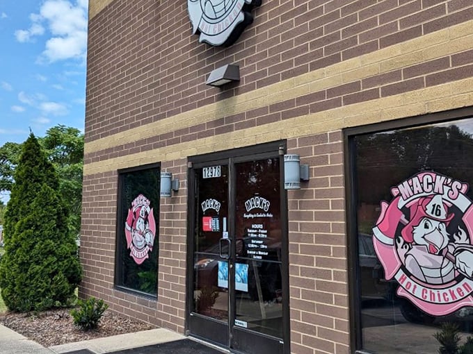 Mack's pink pig mascot grins knowingly - he's seen grown folks cry tears of joy over this chicken.