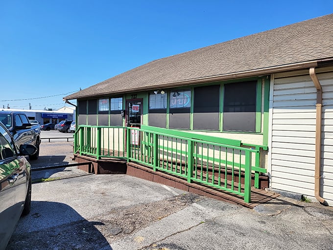 Mill Street Diner's humble exterior with its cheery green railing doesn't prepare you for the flavor explosion waiting inside.