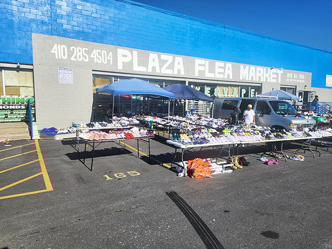 The bright blue Plaza Flea Market building beckons bargain hunters like a beacon of endless shopping possibilities.