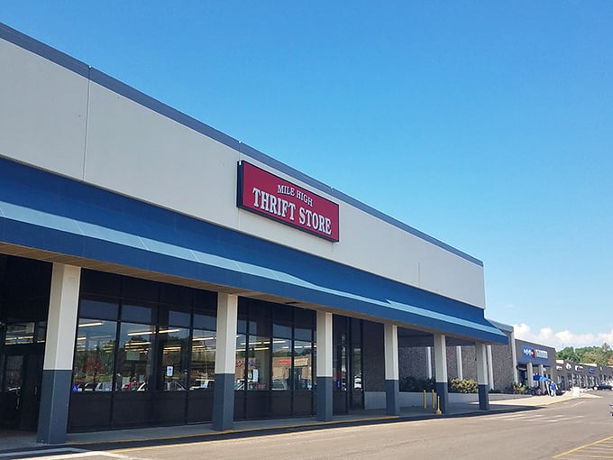 Mile High Thrift's blue awning beckons bargain hunters like a retail oasis in the suburban landscape.