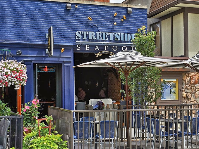 Streetside Seafood's vibrant blue facade is like a beacon for seafood lovers. The flower-adorned patio practically whispers, "Come sit a while and watch the world go by."