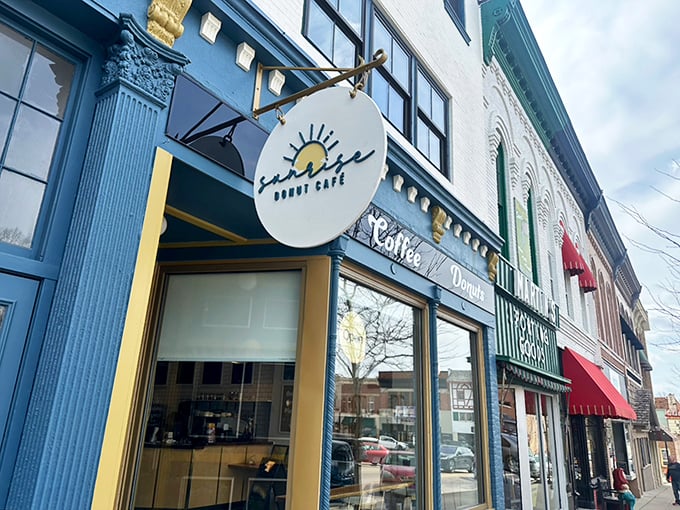 Sunrise Donut Café's blue storefront brings a pop of color to Monroe's main street, promising morning magic inside.