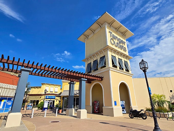 Tanger Outlets Houston beckons with that familiar yellow tower, like a lighthouse guiding ships to safe harbor—except the treasure is designer deals.