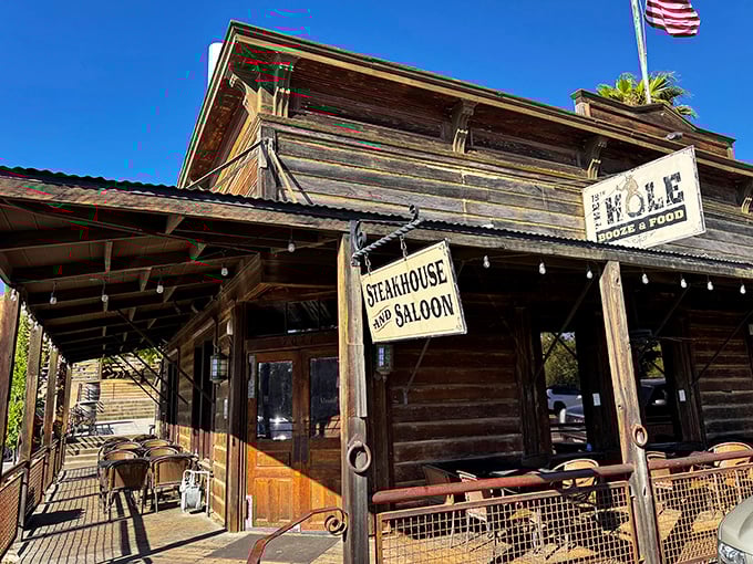 The Hole's rustic wooden facade isn't just Instagram-worthy—it's a time portal to when steaks were cooked with patience and skill.