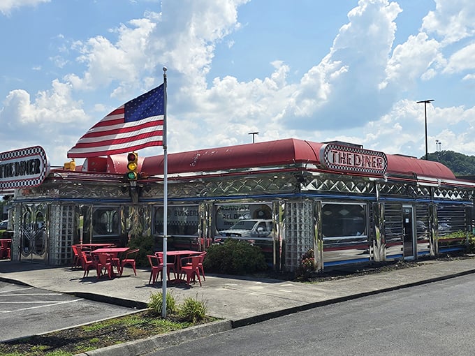 The Diner's gleaming silver exterior and classic American flag scream "road trip destination" – like finding a 1950s postcard come to life.