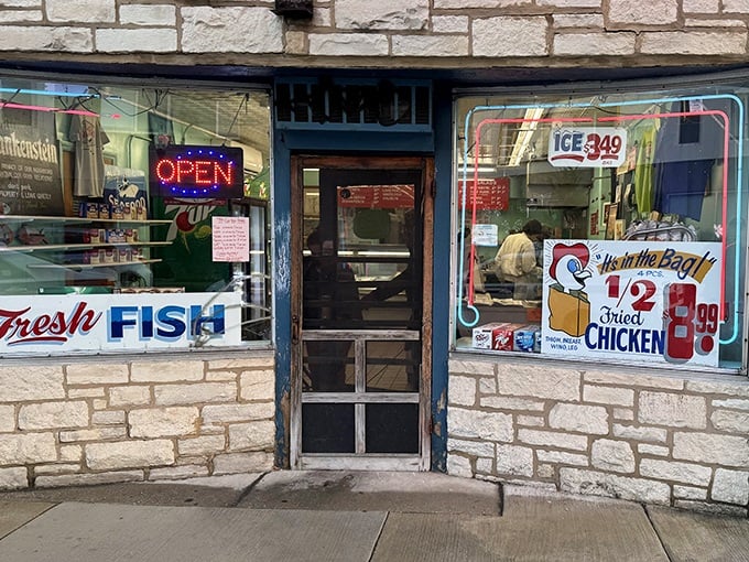 Fresh fish signs in windows are like lighthouses for hungry souls seeking authentic flavors.