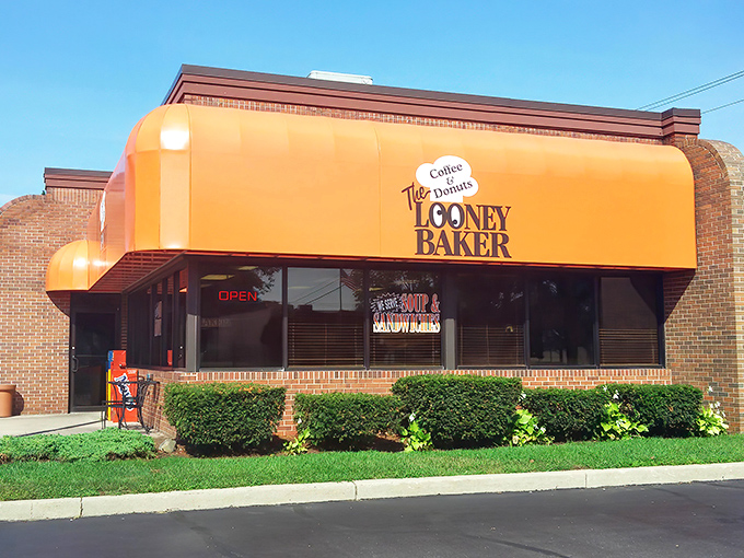 That bright orange facade isn't just eye-catching – it's practically a beacon calling all donut lovers to sweet salvation.