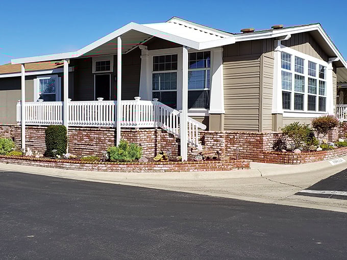 Brick accents and white railings make these manufactured homes look like they belong in suburbia's hall of fame.