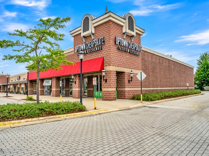 That brick facade with red awnings whispers "trendy finds ahead" louder than a fashion magazine.