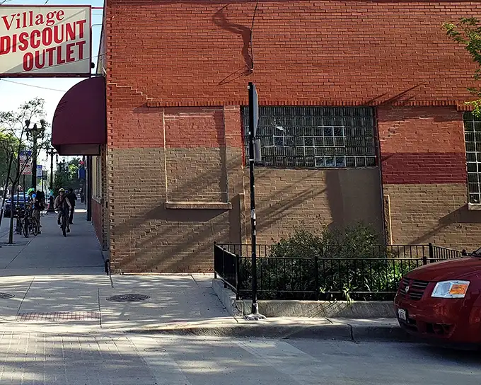 Village Discount Outlet's classic brick facade hides a world of affordable fashion finds in Chicago's heart.