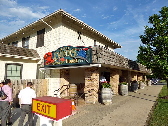 The entrance to crab paradise – where wooden barrels and brick columns frame the gateway to butter-drenched seafood heaven.