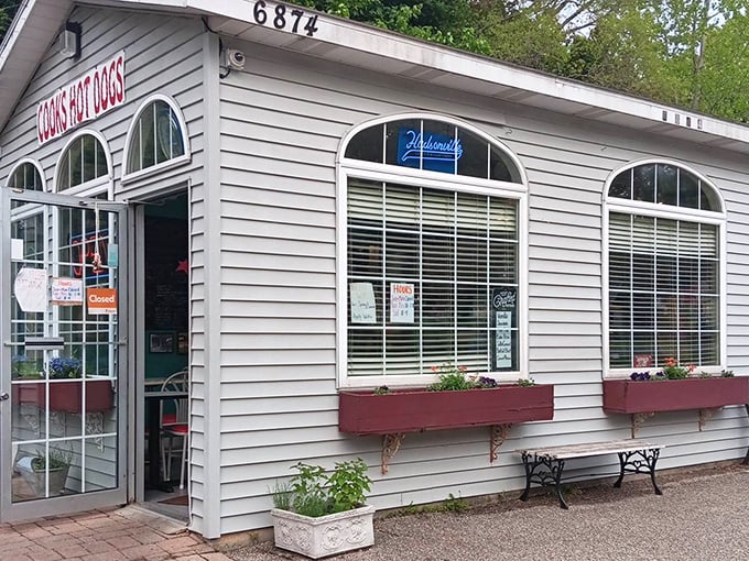 Those arched windows frame more than just a restaurant – they showcase pure Americana on a bun.