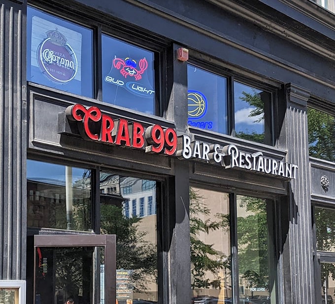 The neon crab sign glows like a beacon for seafood pilgrims wandering through Indianapolis. Follow the light!