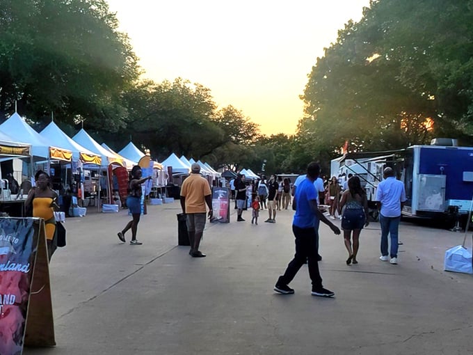 Evening lights and friendly faces fill Dallas Market Hall Flea Market, where visitors explore unique vendors, tasty treats, and community spirit.