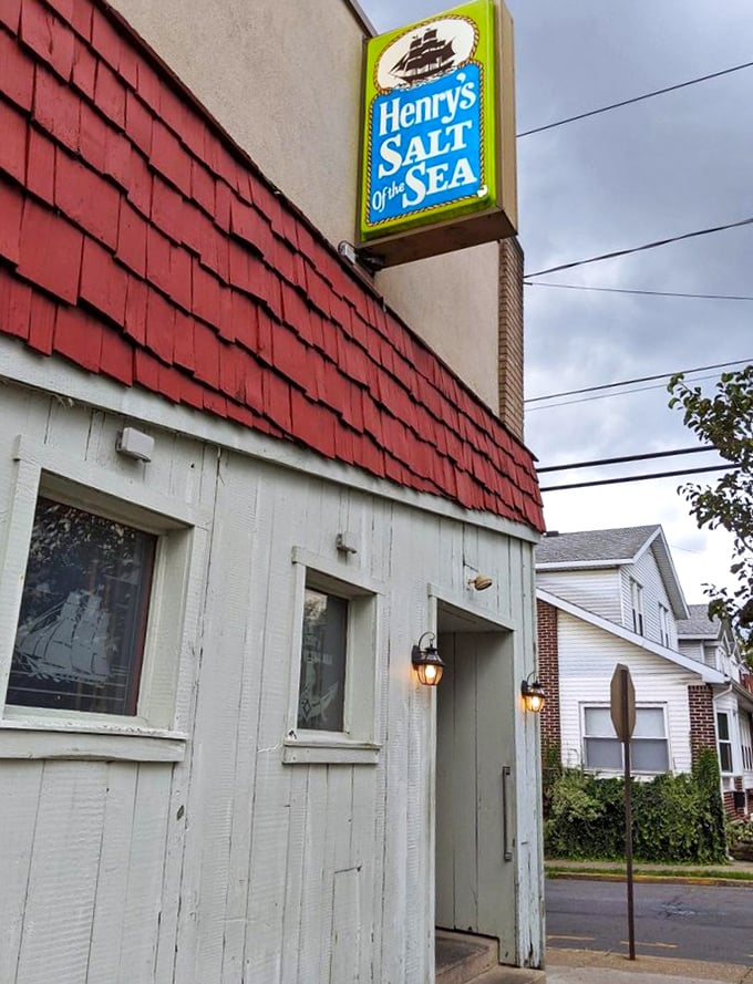The weathered wood and nautical sign promise authentic seafood flavors in this charming neighborhood spot.