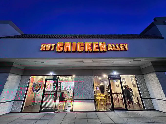 When the neon glows at Hot Chicken Alley, you know the fryers are singing Nashville's greatest hits.