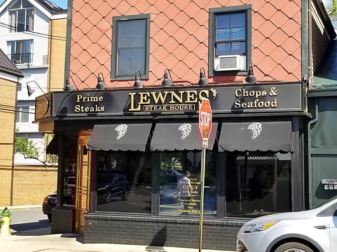 The classic black awnings and historic brick facade of Lewnes' whisper promises of perfectly aged steaks within—no neon signs needed.
