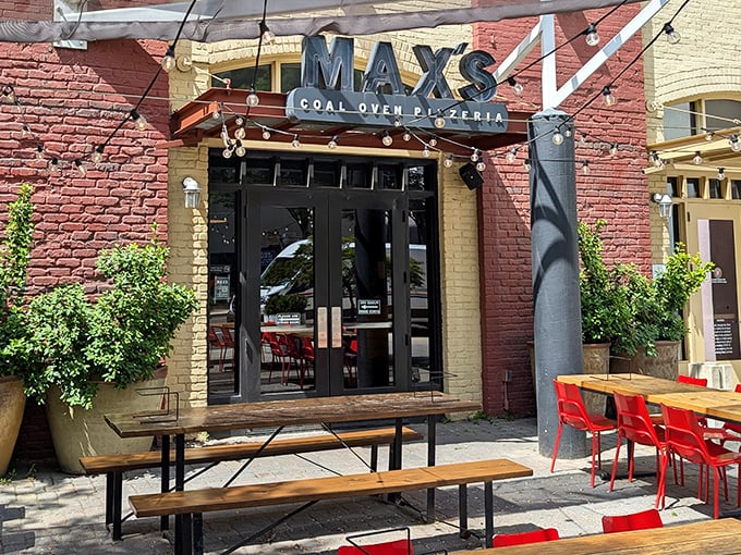 Those benches and bistro tables whisper "sit, stay, savor" like a European piazza transported to Georgia soil.