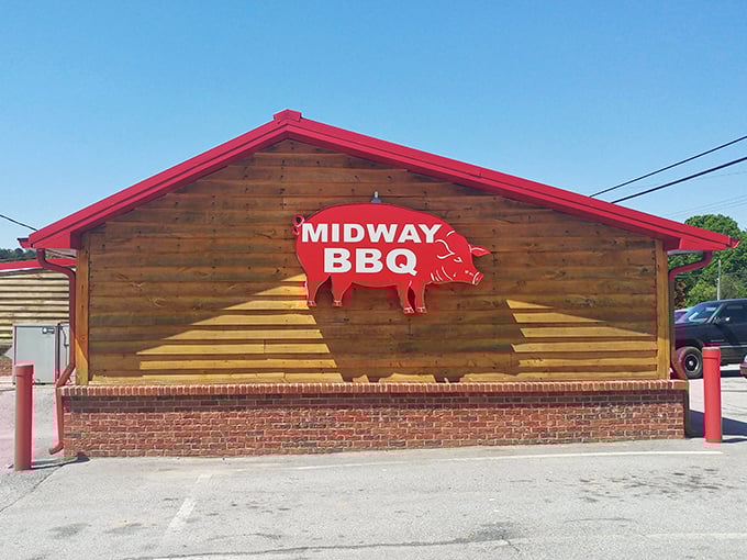 Morning light kisses Midway BBQ's blue roof – a humble temple to the art of slow-cooked pork.