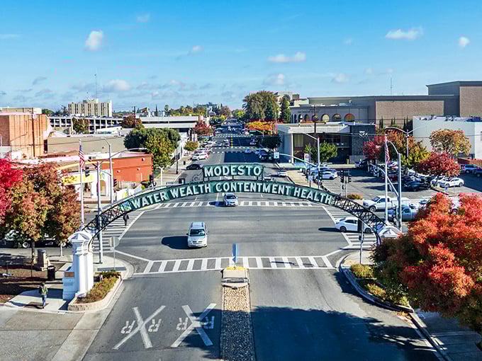 Under Modesto's famous arch, "Water, Wealth, Contentment, Health" isn't just a slogan—it's a promise wrapped in autumn's fiery embrace.