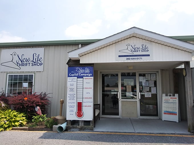 The friendly storefront of New Life Thrift Shop displays their capital campaign progress, showing how shopping helps the community.
