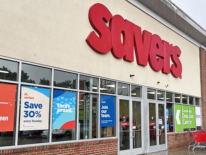 The red Savers sign glows with promise – inside lies a labyrinth of potential fashion finds and household treasures.