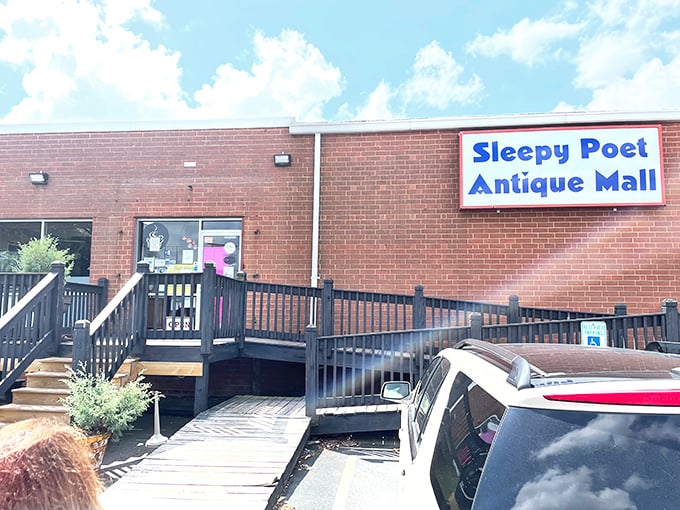 The cheerful blue sign beckons like a lighthouse for antique lovers, promising discoveries that'll make your neighbors wonderfully envious.