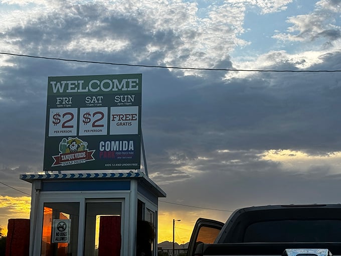 That dramatic sunset backdrop makes even the most humble swap meet entrance feel like a movie set.