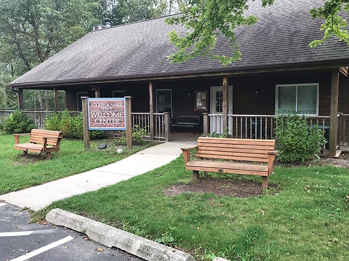 The rustic Welcome Center greets visitors with Midwestern charm. Those benches practically whisper, "Sit a spell and plan your adventure."