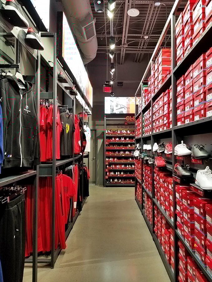 The Nike Factory Store—where the wall of red boxes holds more treasures than Indiana Jones ever discovered. Your fitness tracker will count steps and savings.