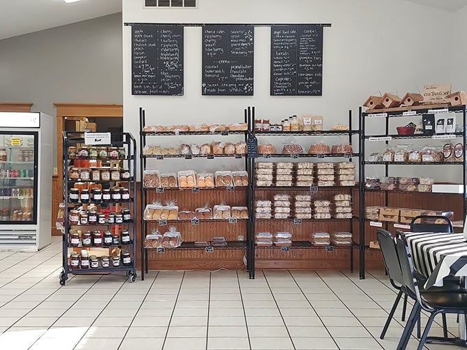 The chalkboard menu and well-stocked shelves tell a delicious story—each loaf and pastry representing generations of baking expertise.