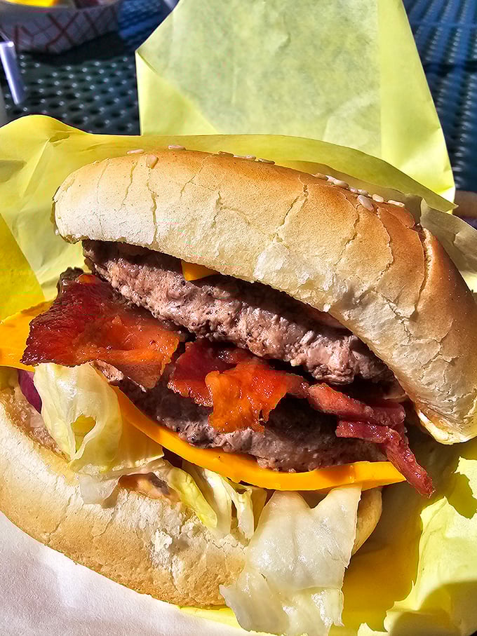 This isn't just a bacon burger—it's edible architecture, where each layer plays its crucial role in the symphony of flavors.