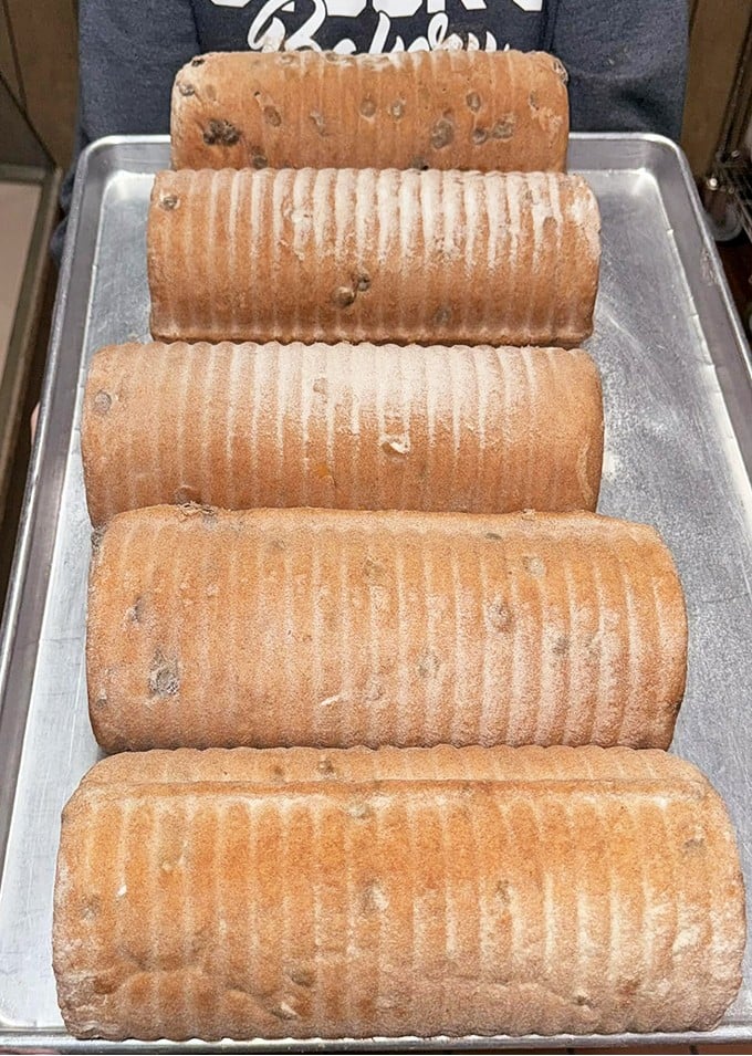 These golden-brown loaves of cinnamon raisin bread aren't just baked goods—they're edible time machines to your grandmother's kitchen.