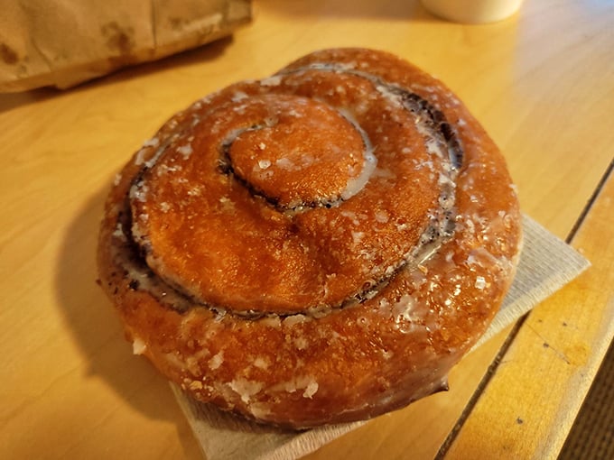 This cinnamon roll isn't just breakfast, it's an edible hug – golden, glistening, and guaranteed to make Monday mornings bearable again.