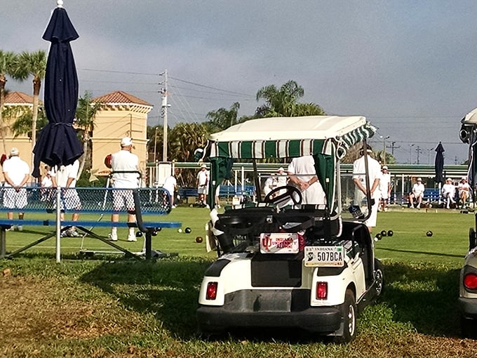 Where lawn bowling meets golf cart culture – a quintessential Kings Point scene that perfectly captures active retirement in the Sunshine State.