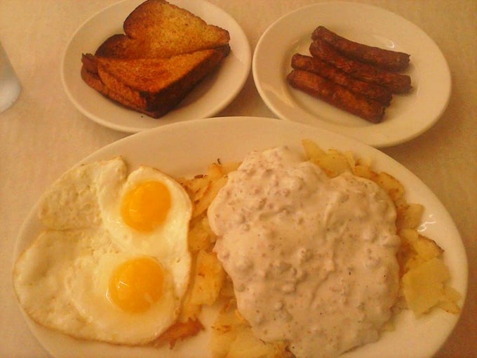 The star of the show: country fried steak smothered in pepper-speckled gravy alongside sunny eggs. This plate doesn't just satisfy hunger—it solves existential crises.