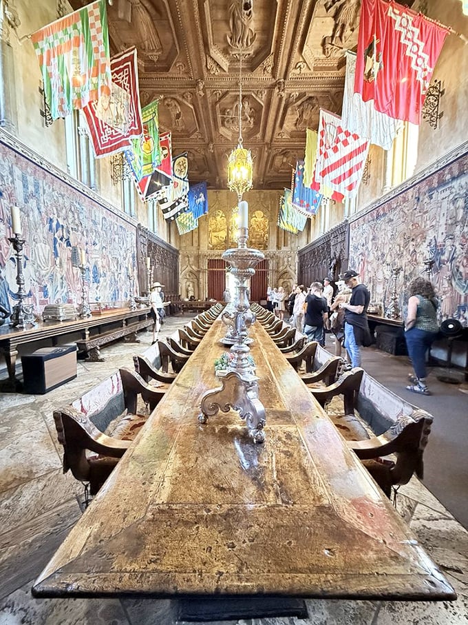 Imagine dining with Hollywood royalty at this impossibly long table. The flags overhead aren't just decoration—they're conversation starters for when celebrity small talk runs dry.