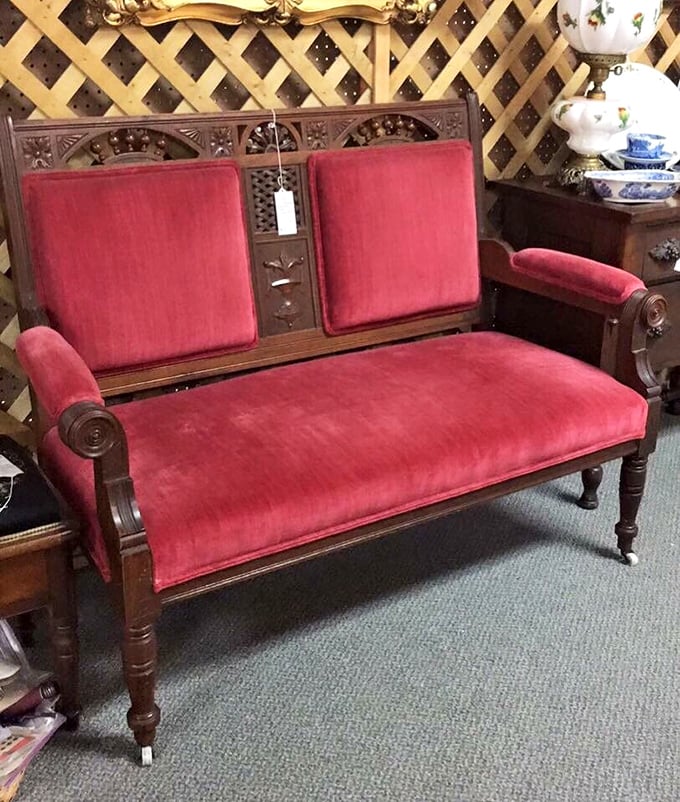 This Victorian-era settee isn't just furniture—it's a time machine upholstered in velvet. Downton Abbey, eat your heart out.