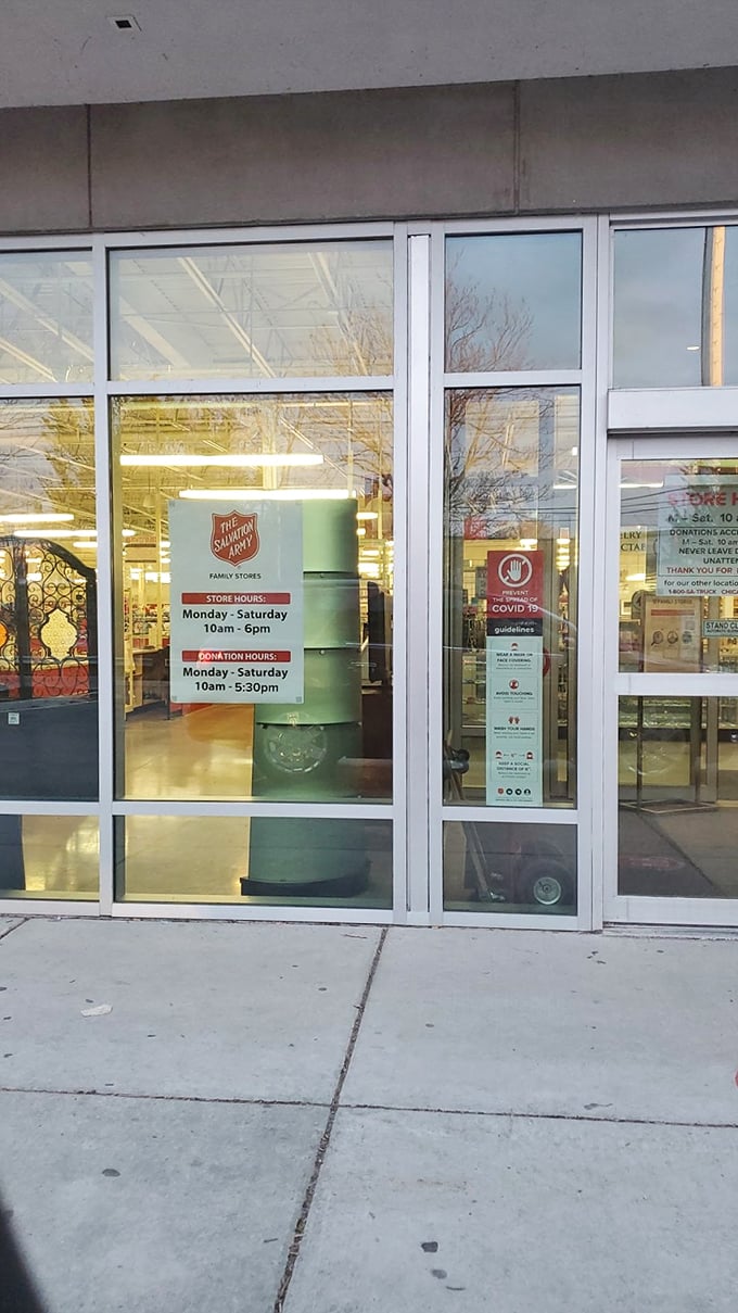 Store hours posted clearly on the entrance doors—the gateway to what some Chicago bargain hunters consider their happy place.