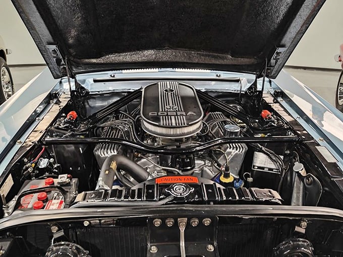 Peek under the hood of automotive history—this meticulously maintained Ford V8 engine represents American muscle in its purest form, mechanical poetry in motion.
