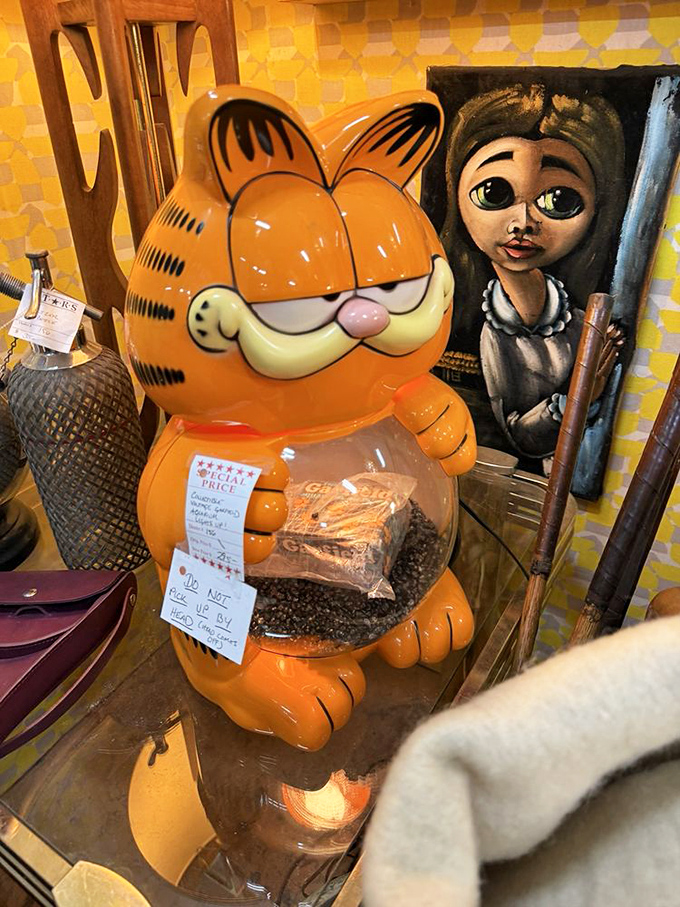 "I hate Mondays, but I love storing your coffee beans." This vintage Garfield cookie jar sits smugly next to artwork that's either delightfully quirky or mildly haunting.