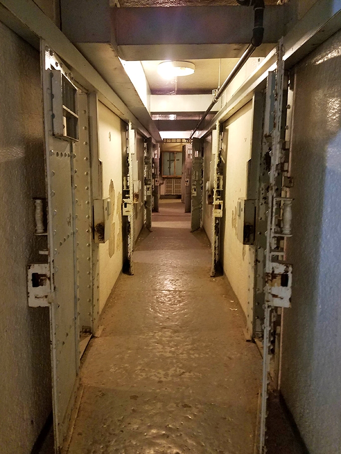 Hotel California, correctional edition—you can check out any time you like, but you could never leave. The institutional yellow hallway speaks volumes about life behind bars.
