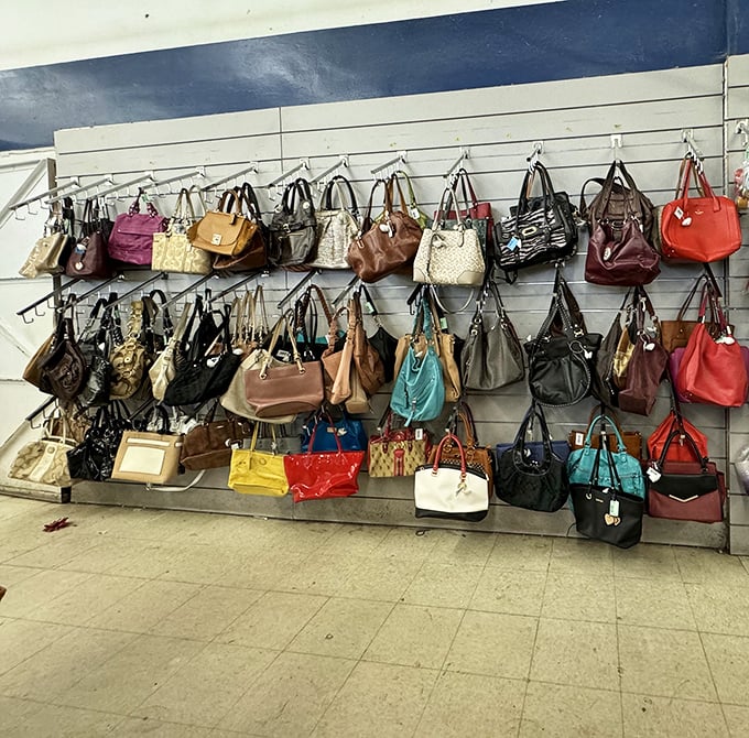 Handbag heaven! Designer purses hang like colorful fruit ripe for picking, each one waiting to start its second chapter with a new owner.