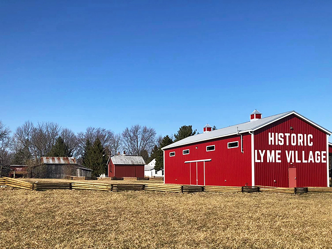 At Historic Lyme Village, that brilliant red barn isn't shouting for attention—though it certainly deserves it. Rural history preserved in living color.