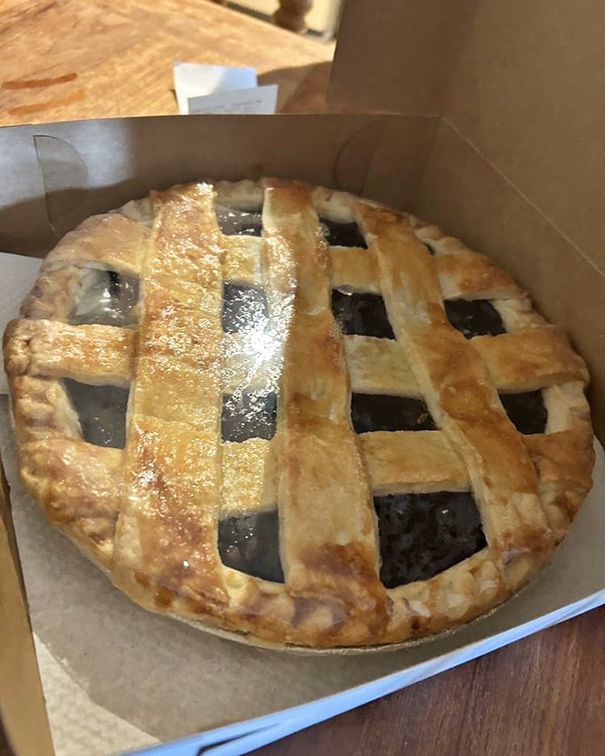 A perfect lattice-topped pie reveals its dark, rich filling – the legendary shoo-fly creation that's worth every mile of the journey.