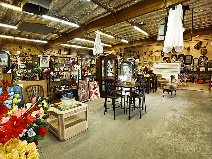 A wonderland of vintage furniture, framed art, and collectibles arranged in organized chaos—like your eccentric aunt's living room, if she collected everything.