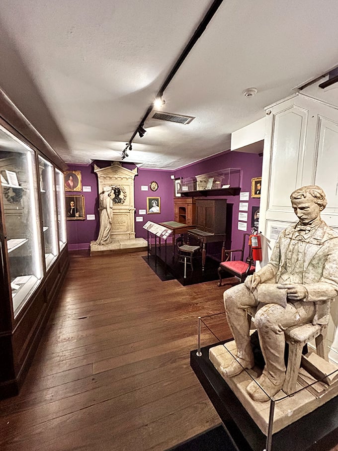 Purple walls create the perfect gothic atmosphere where Poe's literary genius comes alive in every corner.