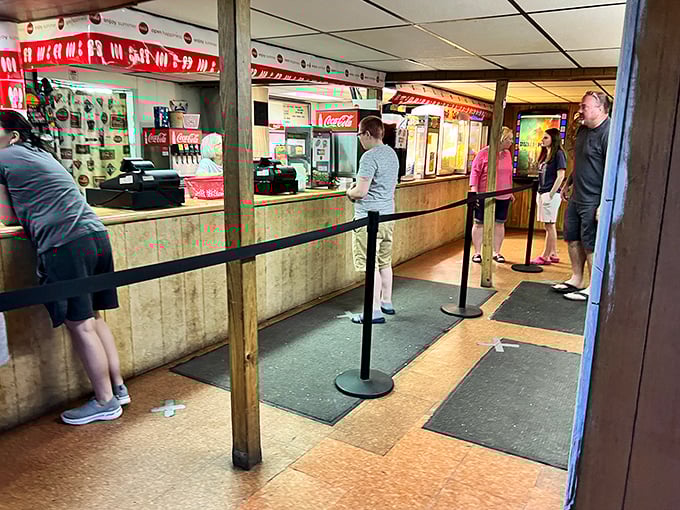 Wood paneling and Coca-Cola signs—this concession stand hasn't changed since Nixon was president, and thank goodness for that.