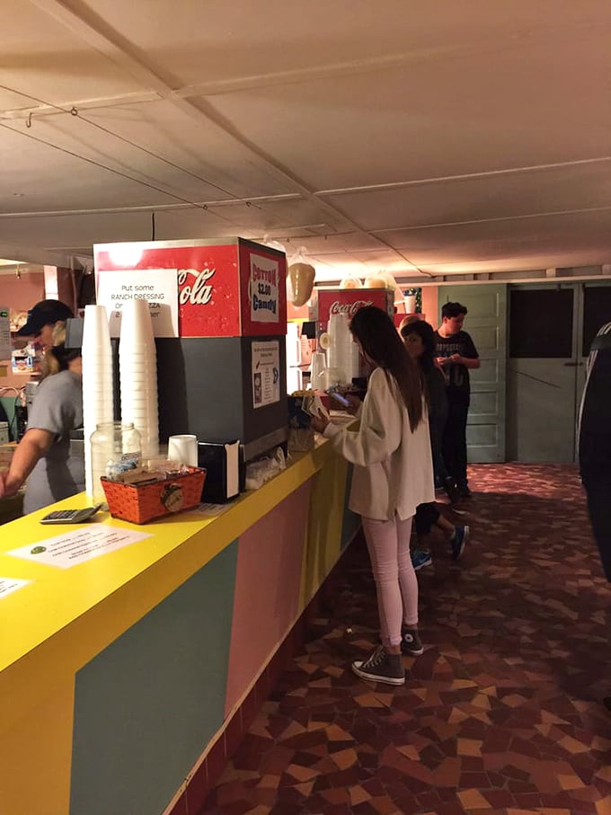 The concession stand's vibrant colors and retro design aren't manufactured nostalgia—they're the real deal, preserved like a time capsule.